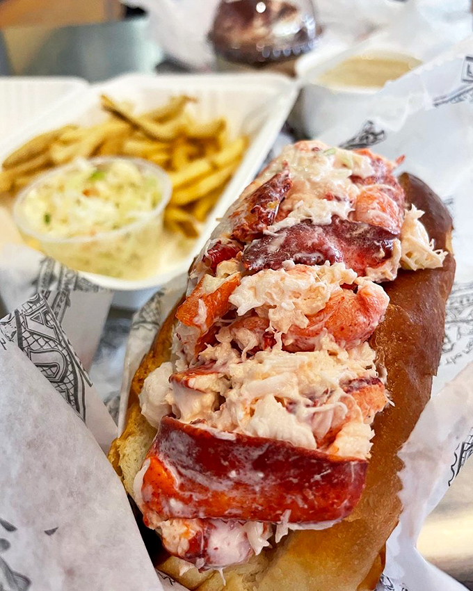 The lobster roll that launched a thousand ships... or at least a thousand satisfied sighs. It's a buttery bliss bomb in a bun!