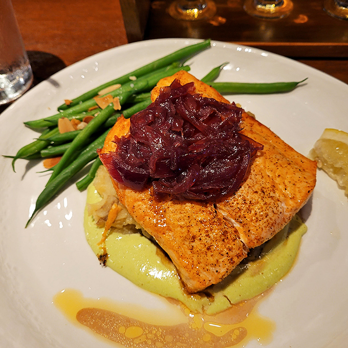 Salmon that's dressed better than most people at a wedding&mdash;perched on velvety puree with caramelized onions as its fashionable hat. Elegance without pretension.