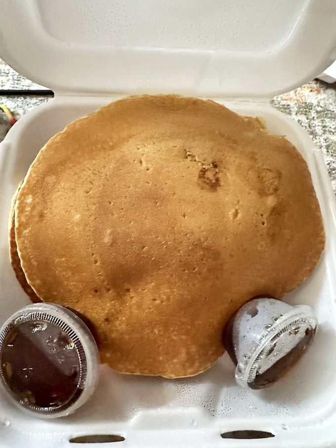 Pancakes so fluffy, they could double as pillows. These golden discs are ready for their syrupy spa treatment.