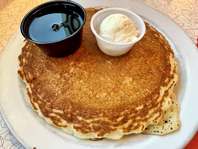 The pancake that ate Casper! Golden, perfectly round, and threatening to escape its plate—this is how carbs should look in your happiest breakfast dreams.