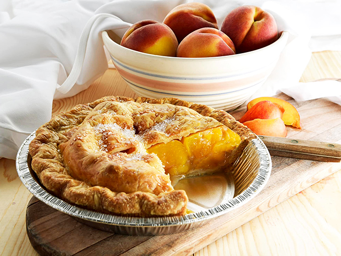 Peach pie paradise! This slice of summer sunshine is so good, it might make you forget about apple for a hot minute.