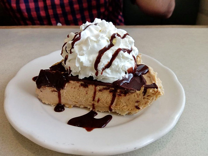 Peanut butter lovers, rejoice! This pie is like a Reese's cup got a PhD in deliciousness. Creamy, dreamy, and topped with a cloud of whipped cream &ndash; resistance is futile.