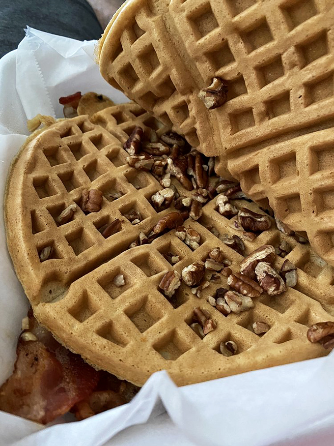 Pecan-studded perfection! These waffles are like a crunchy, syrupy hug for your taste buds. Resistance is futile, so grab a fork and dive in!