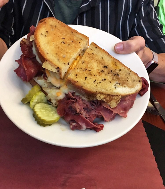 The Reuben in its natural habitat&mdash;towering with meat, melty Swiss, and just enough sauerkraut to make your taste buds dance.