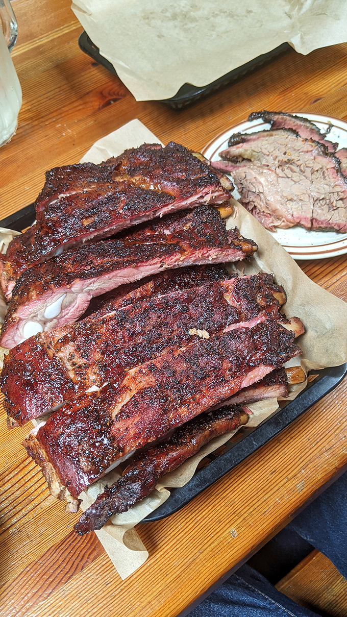 These ribs aren't just fall-off-the-bone tender; they're practically doing the cha-cha off the plate. Finger-licking good doesn't even begin to cover it.