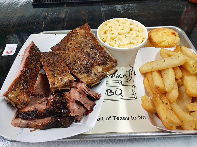 A plate that would make Fred Flintstone jealous. Ribs and brisket team up with mac and cheese for a comfort food hat trick.