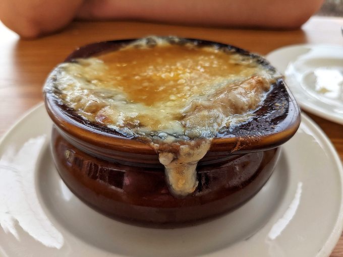 This isn't just soup; it's a bowl of French comfort. That cheese pull? It's like the Eiffel Tower of dairy &ndash; iconic and irresistible.