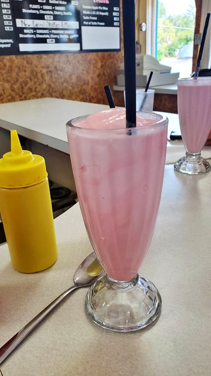Pretty in pink and delicious all over! This strawberry shake is summer in a glass, with a straw for good measure.