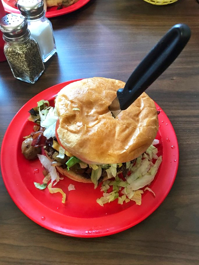 The "Man Up" burger: Where dreams and calories collide. It's not just a meal, it's a delicious challenge to your jaw's elasticity.