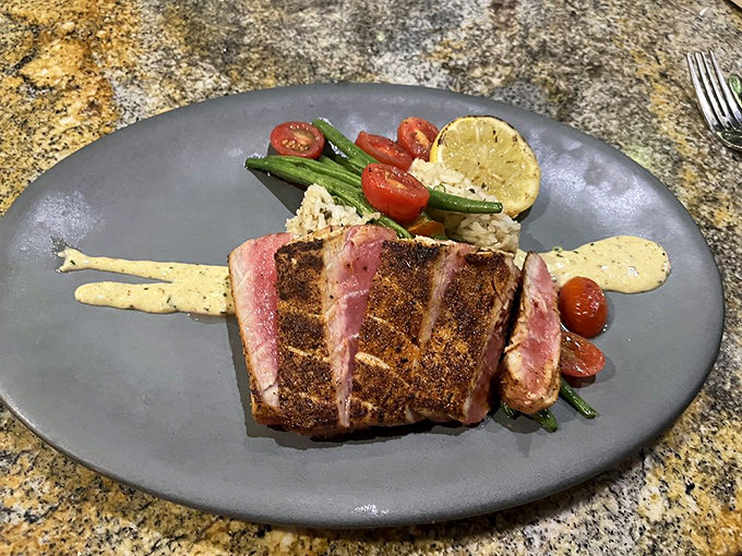 Surf's up on this plate! The perfectly seared tuna steak is giving us major beach vacation vibes. Who needs an ocean when you've got this on your fork?