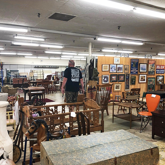 Treasure hunter's paradise! This gentleman's found his Holy Grail, and it's lighting up his face brighter than that antique lamp.