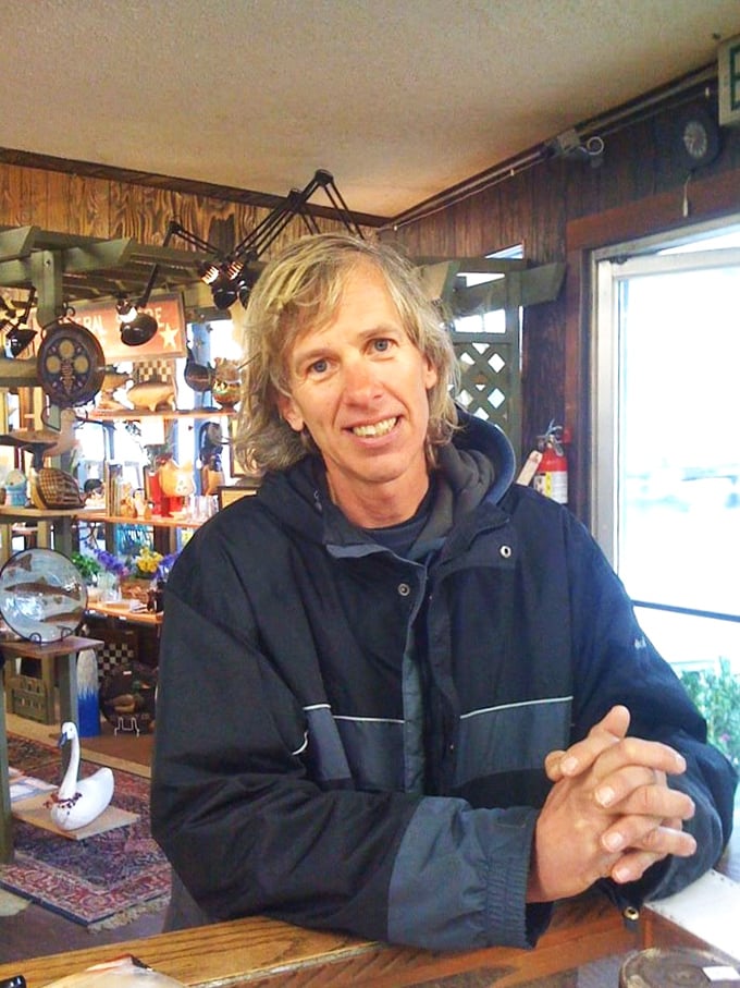 The friendly face of flea market magic. This gentleman's smile says, "I've got just the thing you never knew you needed."
