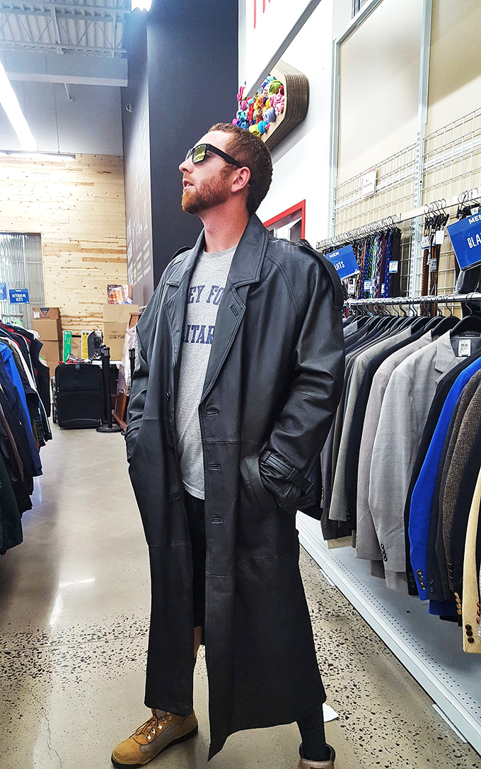 The leather coat section: where everyday shoppers transform into Matrix extras. This gentleman clearly found his Neo moment among the racks.