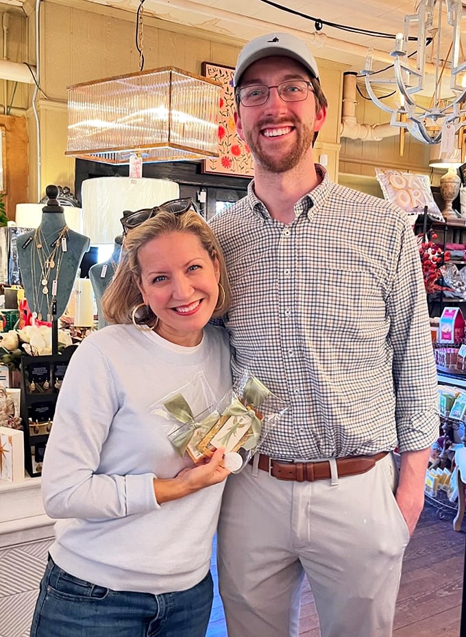 Happy hunters in their natural habitat! Smiles as bright as the chandeliers – must've found the deal of the century.