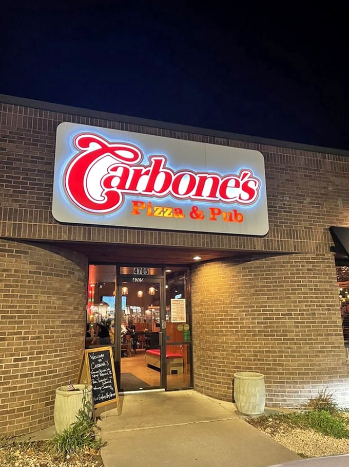 Carbone's Pizza & Pub: This sign promises a night of cheesy bliss. It's like Vegas, but the jackpot is always a perfect pizza.