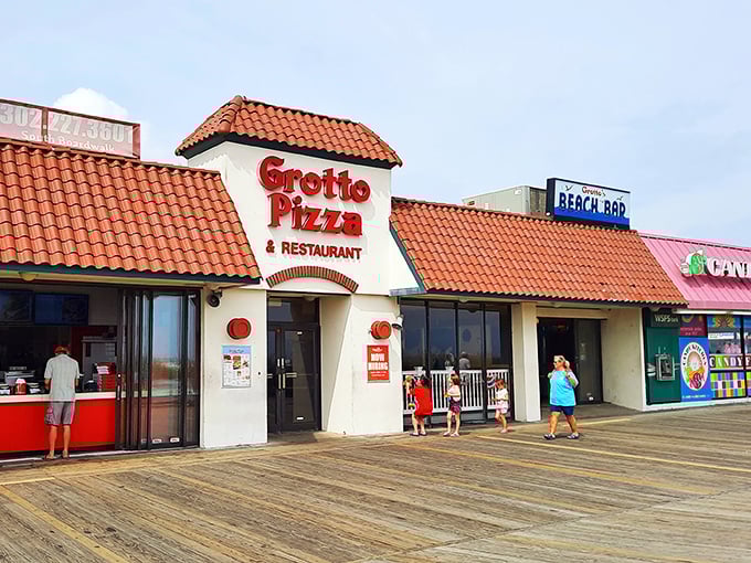 Grotto Pizza on the boardwalk&mdash;where the spiral of sauce meets the spiral of life, and vacation memories are served by the slice.