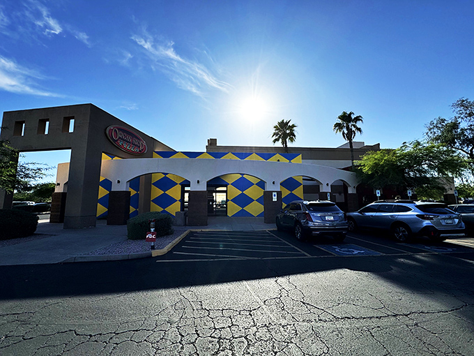 Organ Stop's distinctive blue and yellow exterior hints at the whimsical experience inside—where pizza meets musical theater in the most delightful way.