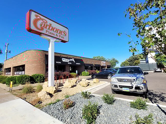 Carbone's classic charm: Red brick, sunny days, and pizza that'll make you want to hug the chef. Minnesota nice, served by the slice.