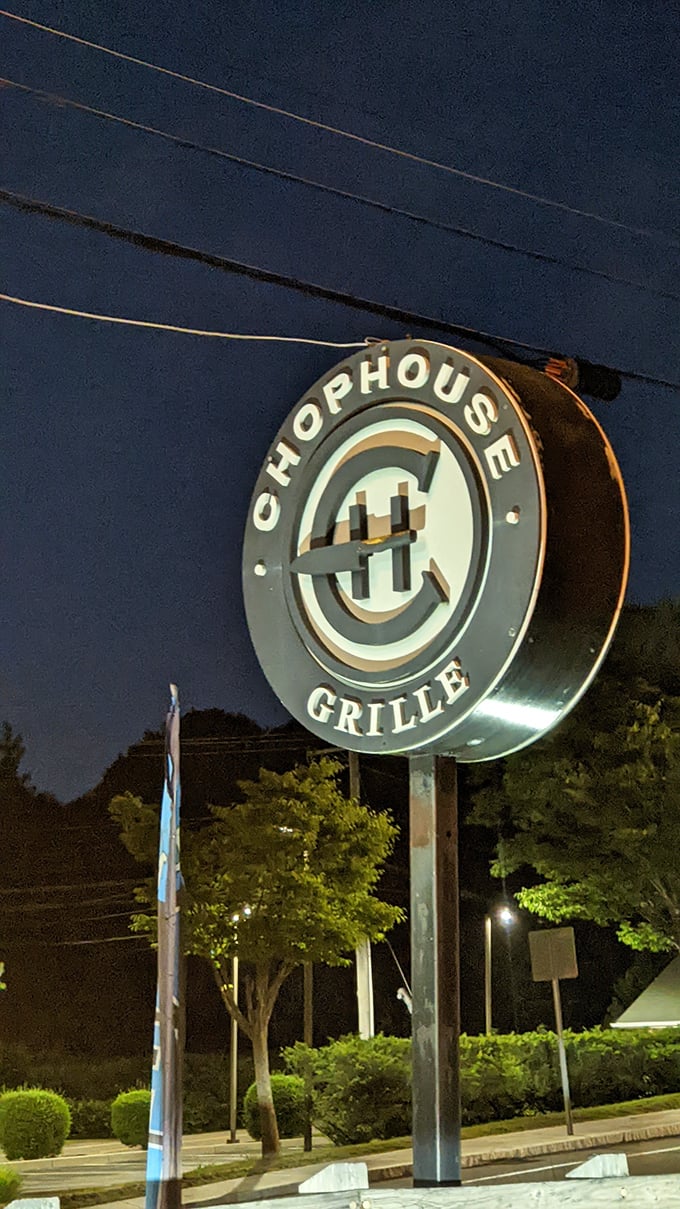 Illuminating the path to steak nirvana. Chophouse Grille's sign shines like a lighthouse, guiding hungry sailors to a safe harbor of deliciousness.