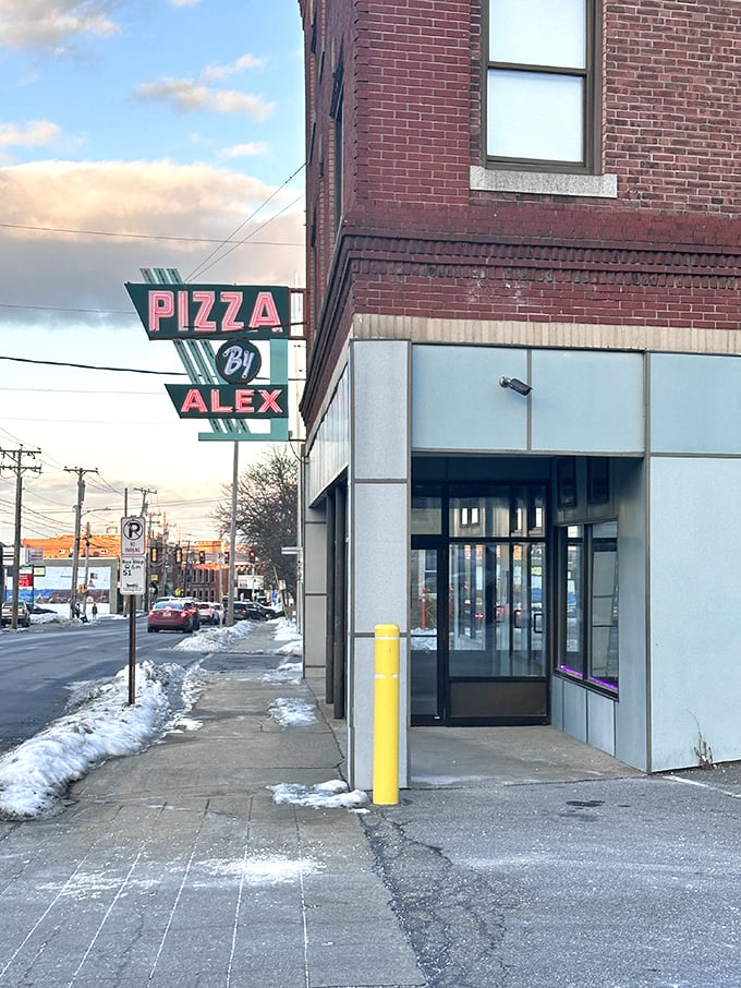 Retro vibes, timeless flavors. Pizza By Alex's vintage sign promises a slice of the past, served piping hot in the present.