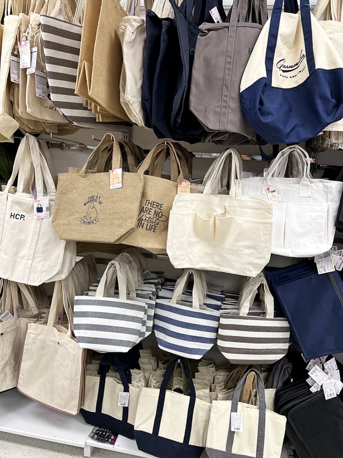 Tote bag heaven where $2 buys you the confidence to declare "THERE ARE NO REGRETS IN LIFE" across your shoulder.