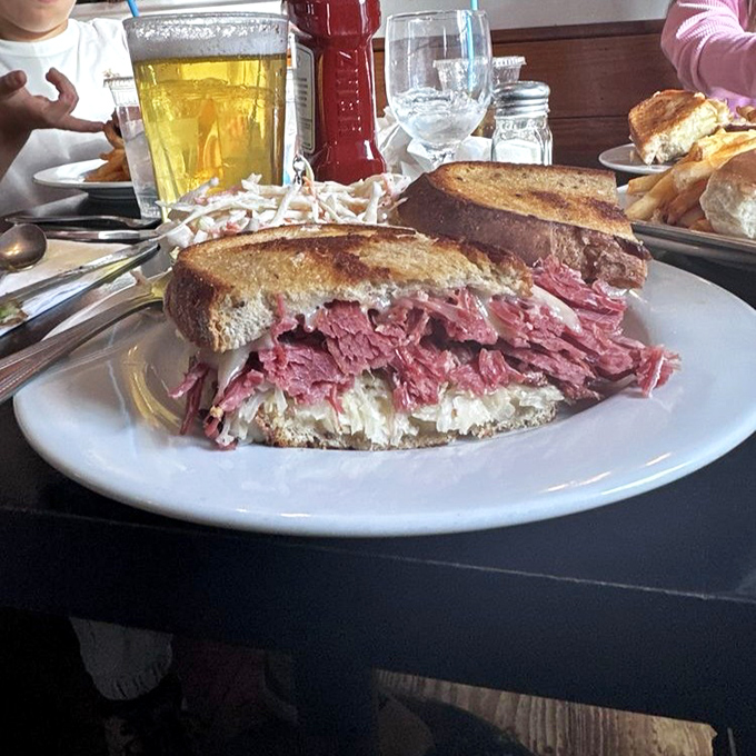 Move over, food pyramids! This Reuben redefines sandwich architecture with its skyscraper of corned beef and melty cheese.