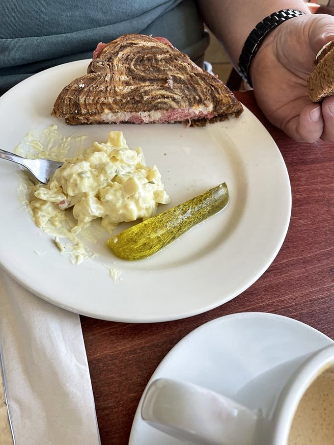 Behold, the best Reuben in town! This sandwich isn't just stacked, it's a skyscraper of deliciousness that'll have you planning your next visit before you've finished the first bite.