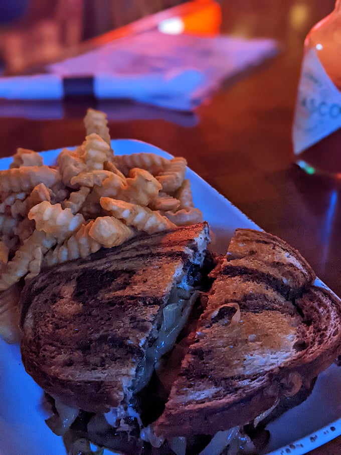 Holy cow! This Reuben is so packed, it's like the entire deli decided to throw a party between two slices of bread.