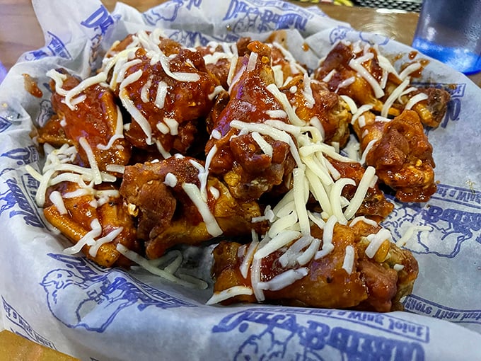 Served with traditional celery sticks, these wings aren't messing around. The sauce-to-wing ratio here is what mathematicians call "the golden proportion."