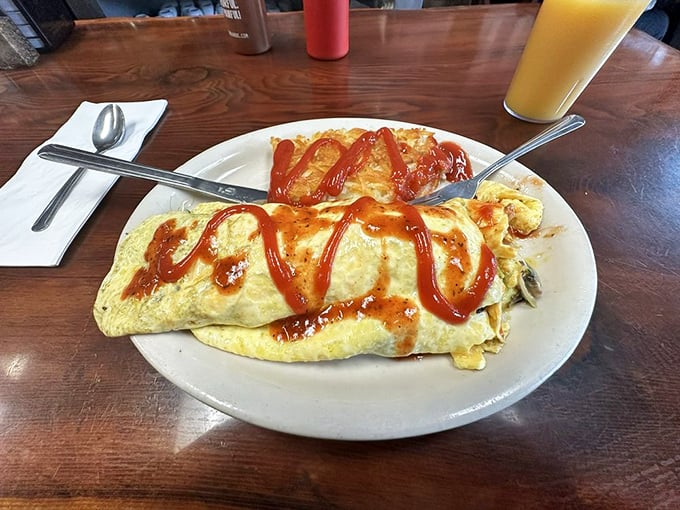 Breakfast of champions! This hearty omelet, draped in a vibrant salsa blanket, is ready to fuel your day &ndash; surf session optional.