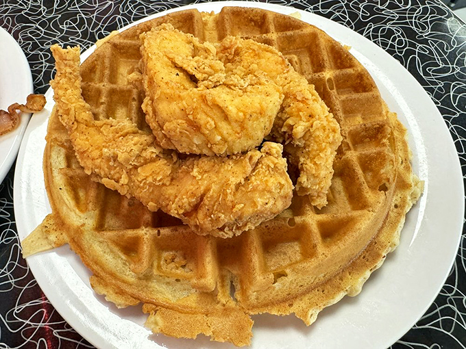 The ultimate breakfast power couple: crispy chicken meets fluffy waffle. It's a match made in diner heaven!