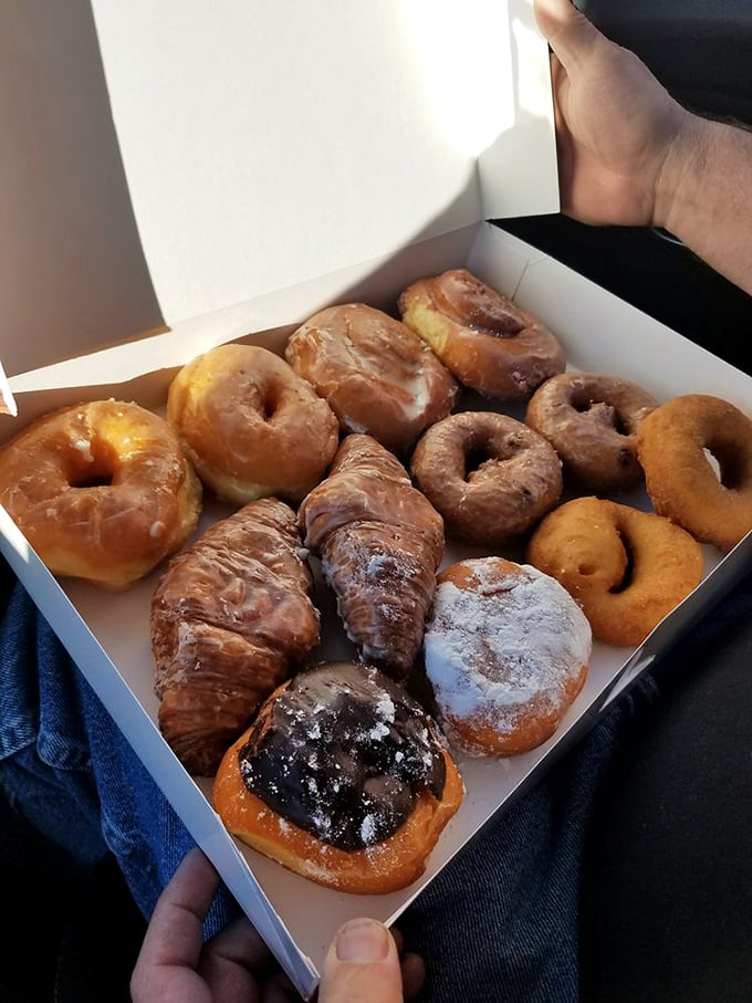 A baker's dozen of joy! This box of assorted donuts is like Netflix for your mouth &ndash; endless options, all guaranteed to entertain.