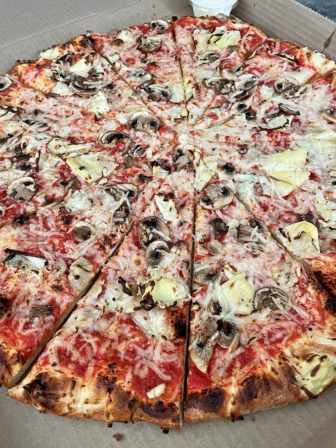 Build-your-own pizza paradise! This pie's got more toppings than the Hubble has stars to count.