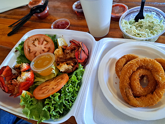 The perfect threesome: lobster, onion rings, and fries. It's like the ocean and the state fair had a delicious love child. Don't forget to share... or not!