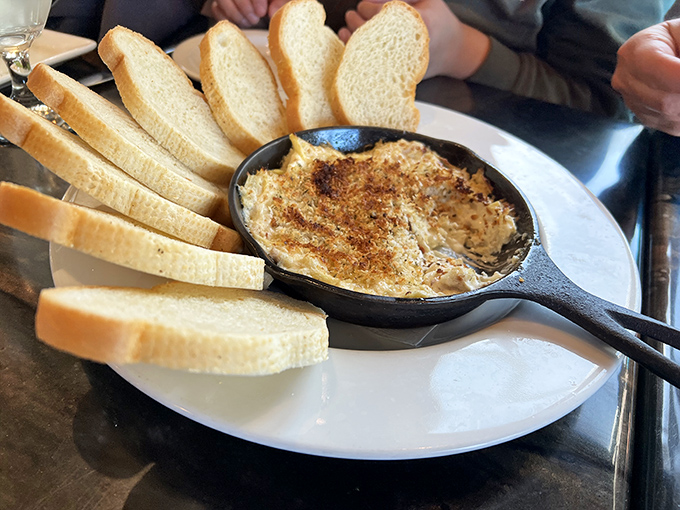 The bread slices stand at attention like eager soldiers, ready to escort that glorious dip from skillet to mouth without missing a delicious drop.