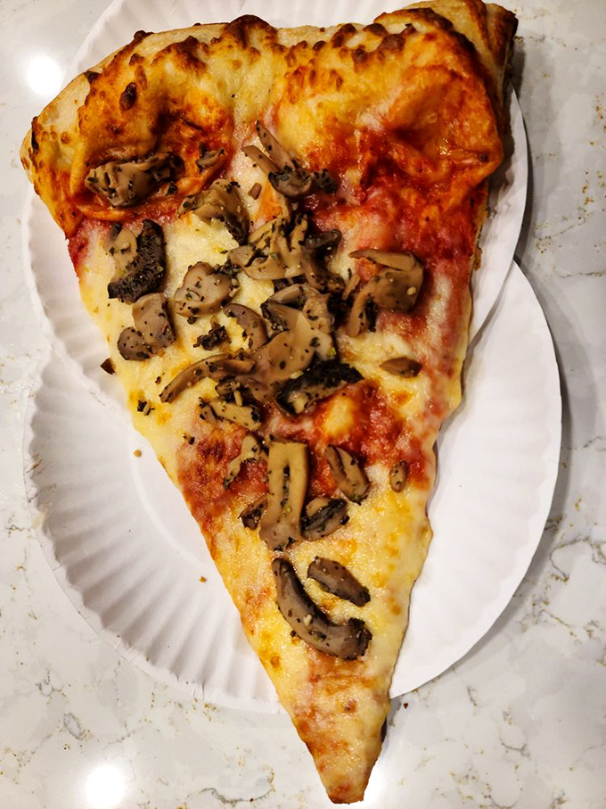 Mushroom lovers, rejoice! This slice is bringing fun-gi to the party, with enough garlic to keep vampires at bay for eternity.