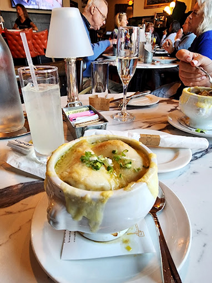 Warning: This French onion soup may cause spontaneous happy dances. Side effects include cheese pulls visible from space and uncontrollable mmm-ing.