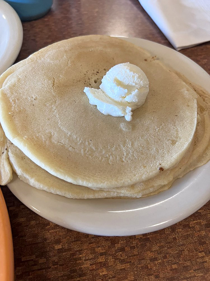 Simplicity at its most delicious. Sometimes, all you need is a perfect pancake and a dollop of butter to make the world right again.