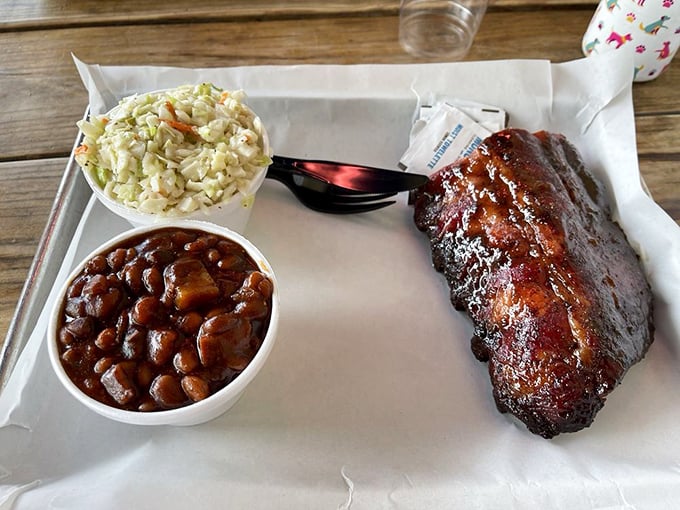 Ribs and beans, the dynamic duo of BBQ. It's like Batman and Robin, if Batman was smoky and Robin was saucy.