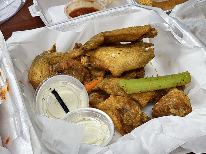 Wings served "naked" with dipping sauce on the side&mdash;a blank canvas for flavor artists who like to control their own heat destiny.