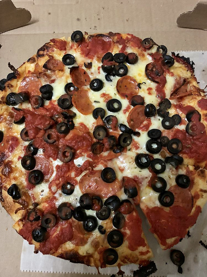 Pepperoni and olives, locked in an eternal dance of flavor! This pizza is so mesmerizing, it could hypnotize you faster than a pendulum-swinging hypnotist.