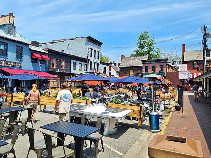 Sun-drenched cobblestone streets invite you to enjoy outdoor dining, lively games, and the charming atmosphere of this bustling historic harbor.