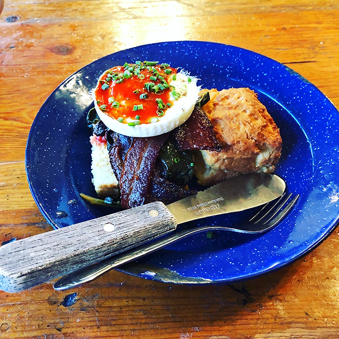 A biscuit sandwich that's more stacked than your Netflix queue. It's a towering testament to the art of breakfast engineering.