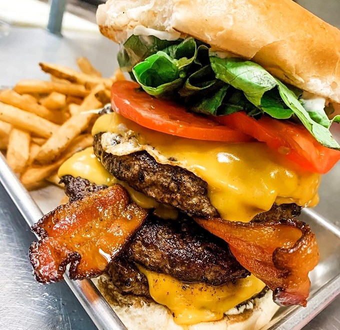 The Barnyard Burger: Where farm animals unite in delicious harmony. It's like Old MacDonald went gourmet!