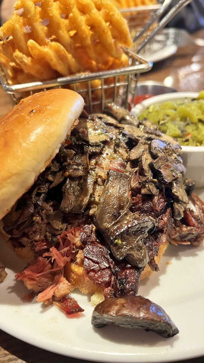 Behold, the brisket sandwich &ndash; a tower of smoky goodness that laughs in the face of dainty appetites. This bad boy means business.