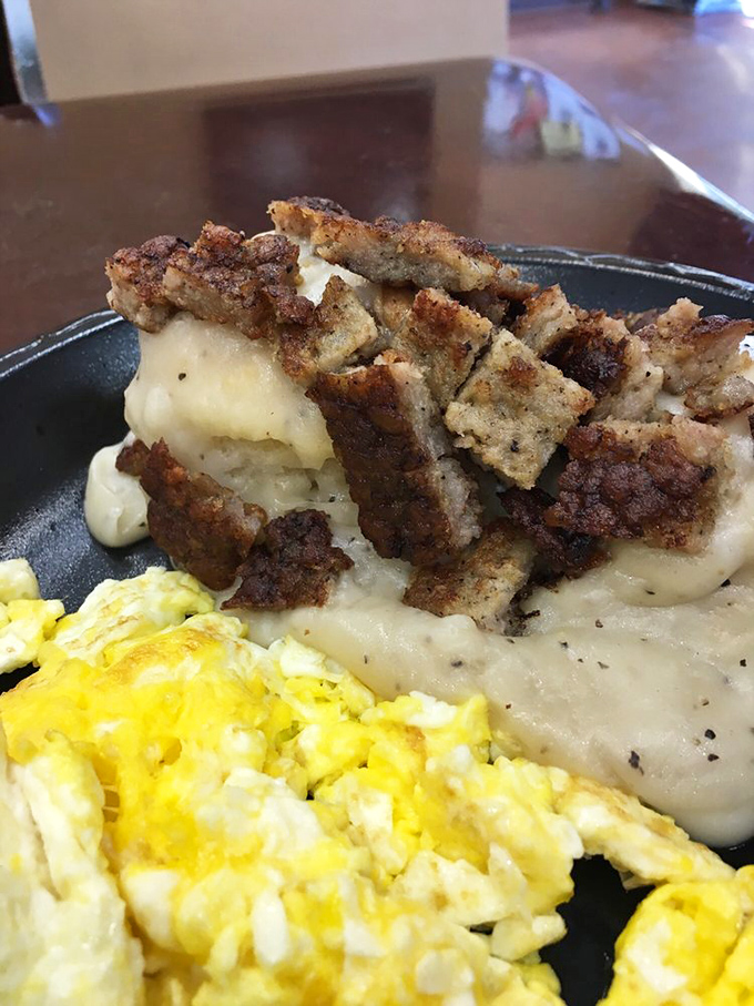 Biscuits so fluffy they could float away, smothered in gravy so rich it should come with a warning label. Dive in and prepare for taste bud nirvana!
