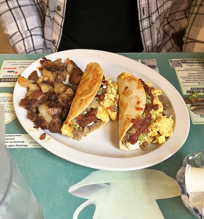 Breakfast tacos: Where morning meets fiesta! These handheld delights are proof that not all heroes wear capes &ndash; some wear tortillas.
