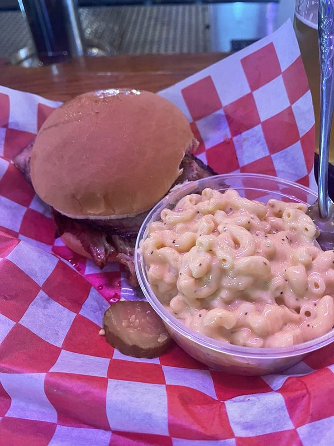 A brisket sandwich that could make a vegetarian weep, paired with mac and cheese that's pure comfort in a cup.