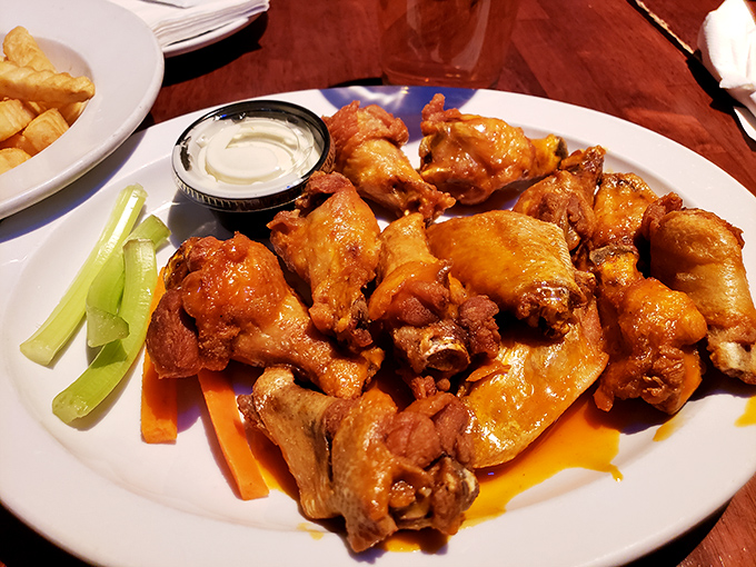 A plate of wings so inviting, it's like they're saying, "Come on in, the sauce is fine!" Don't forget to pack your bib.
