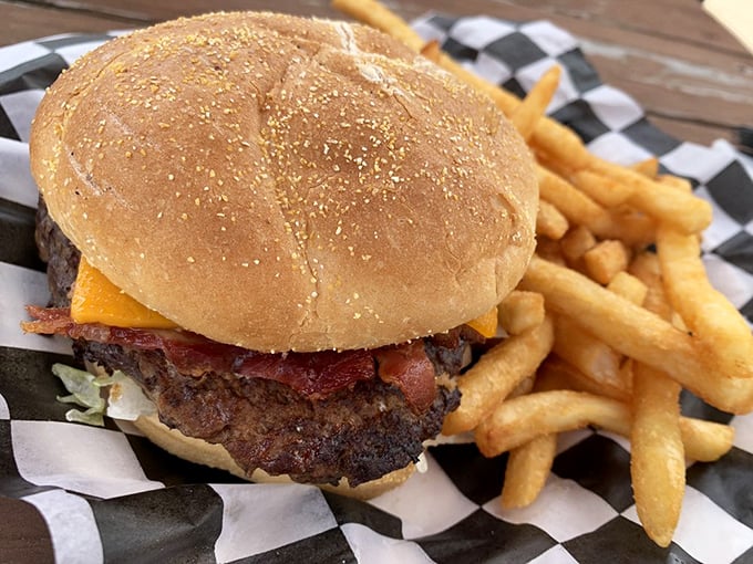 Holy cow! This burger's so juicy, you might need a life jacket. Paired with those golden fries, it's a match made in comfort food heaven.